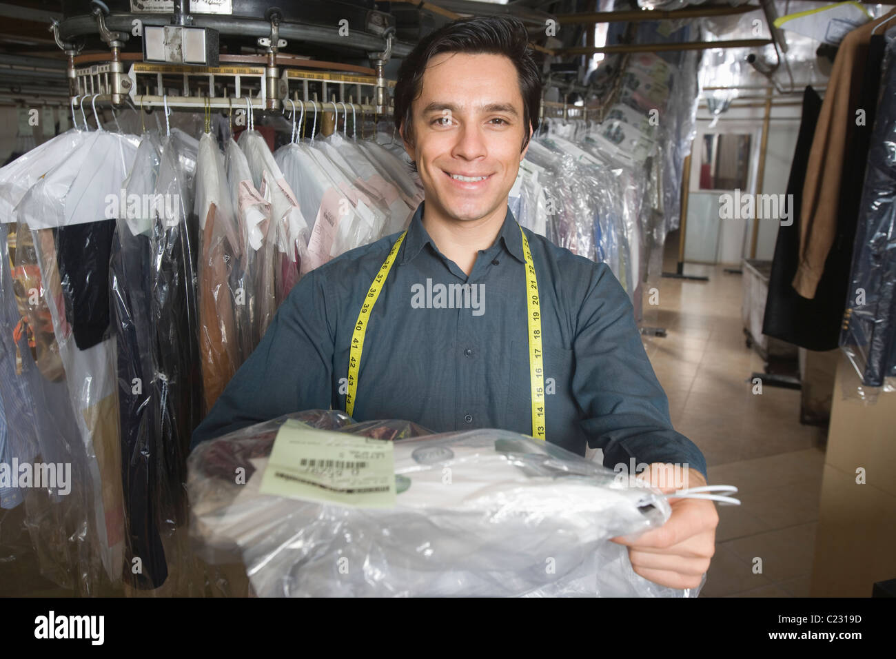 Man working in laundrette hi-res stock photography and images - Alamy