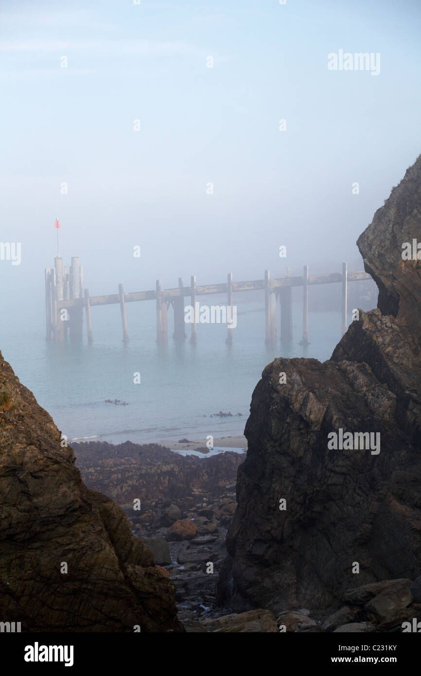 Landing jetty, landing jetty pier, on Lundy surrounded by thick fog in ...
