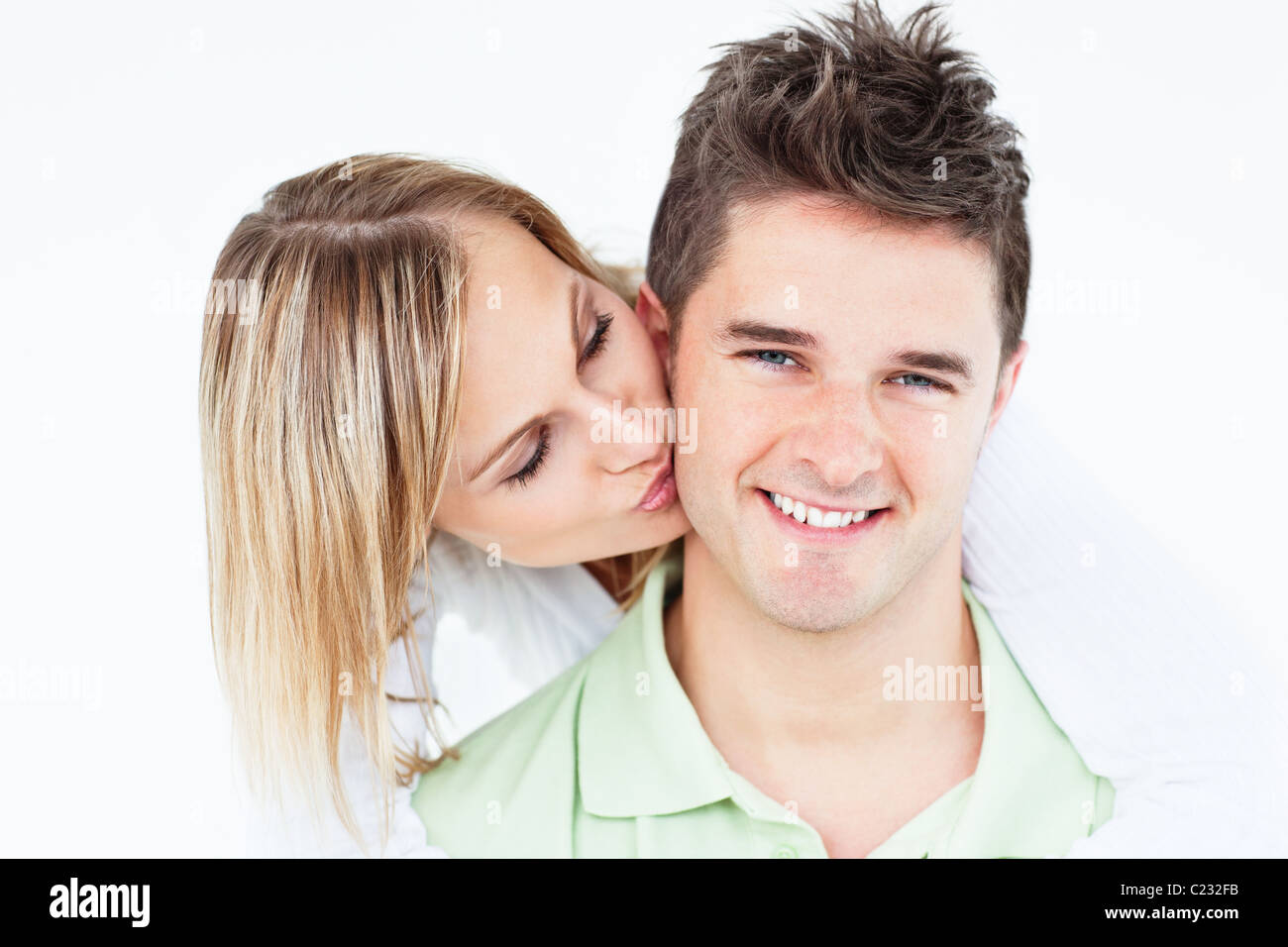 Woman kissing her boyfriend Stock Photo - Alamy