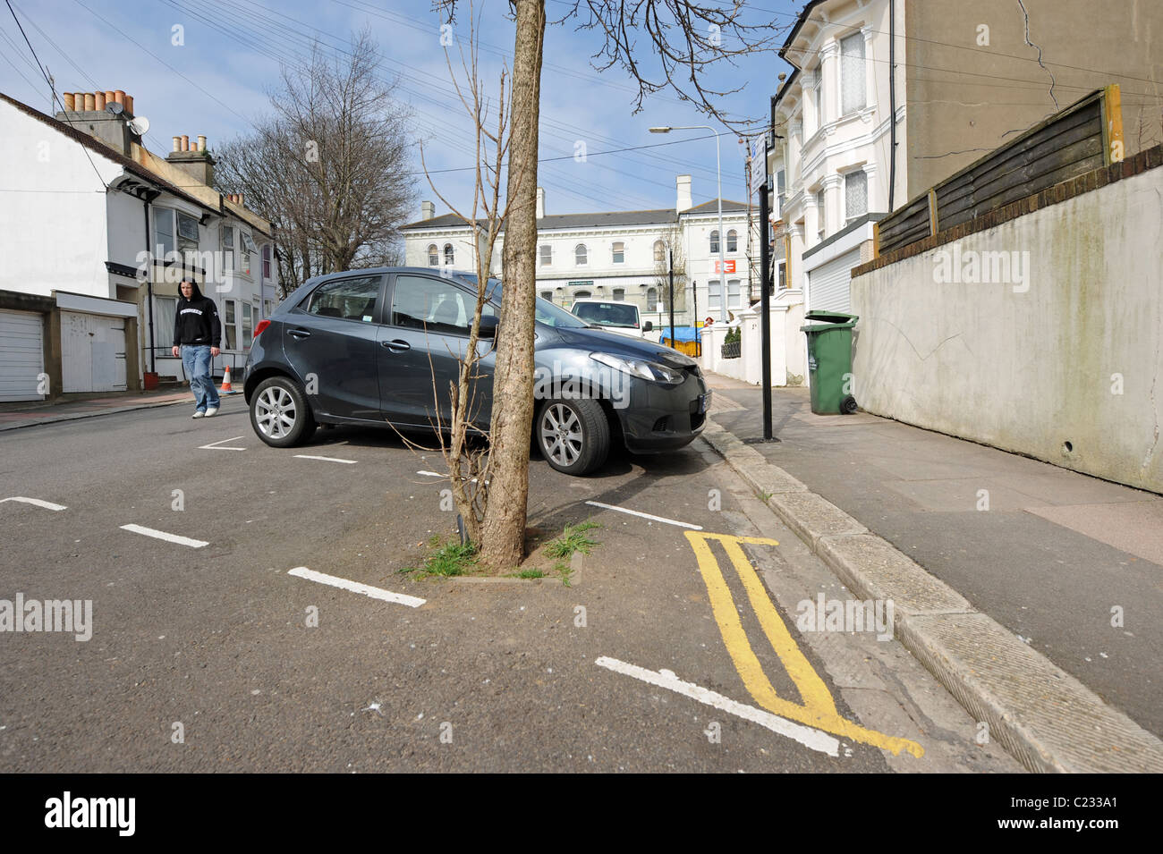 Very short double yellow lines to stop cars parking in a bay with a ...