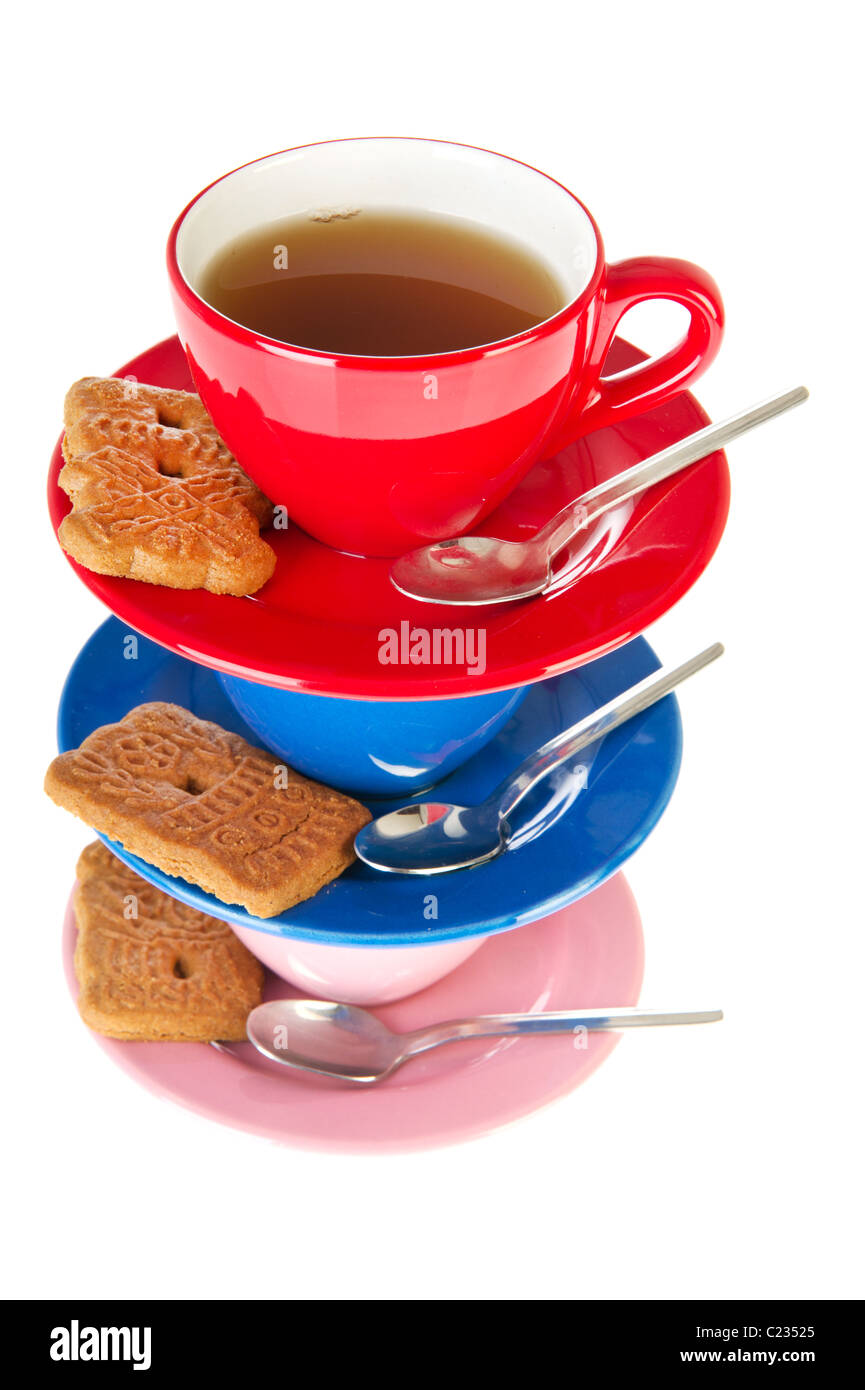 Stacked cups of tea with cookies in red and blue Stock Photo - Alamy