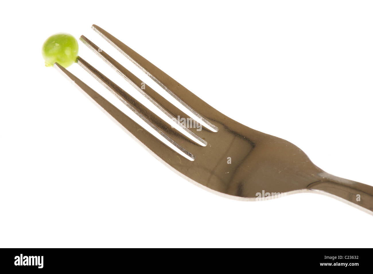 Single green pea on a fork isolated over whote background Stock Photo ...