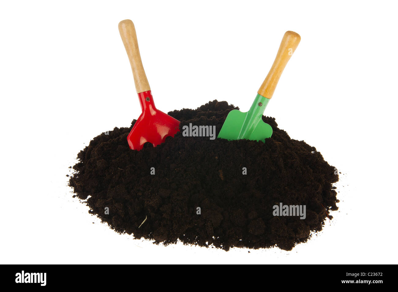 heap of sand with gardening tools isolated over white Stock Photo - Alamy