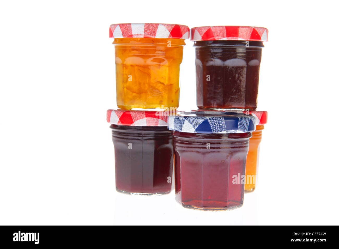 Five various pots of jam on white background Stock Photo - Alamy