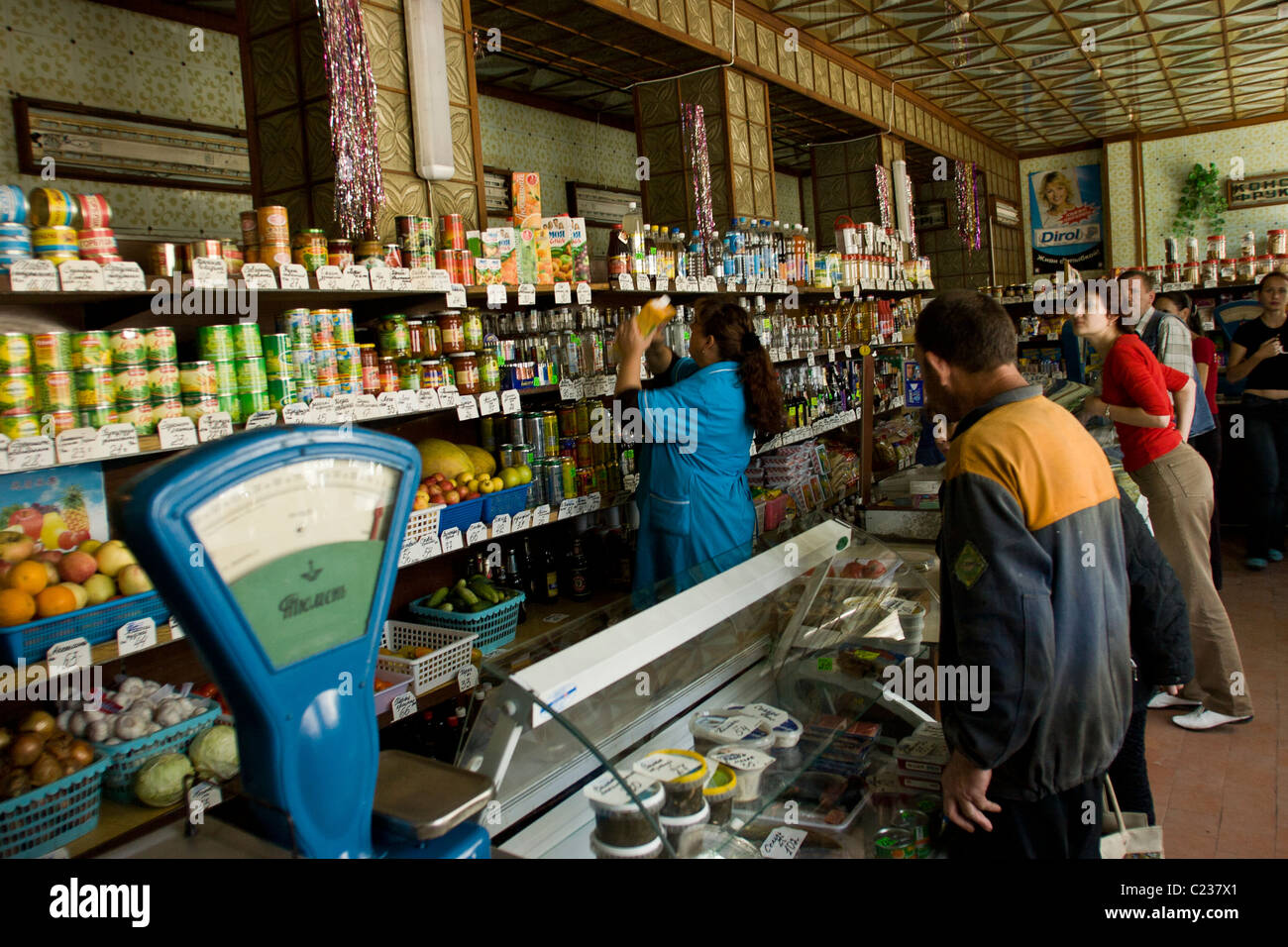 People shop at a general goods store in Sinegorsk, Sakhalin, Russia ...
