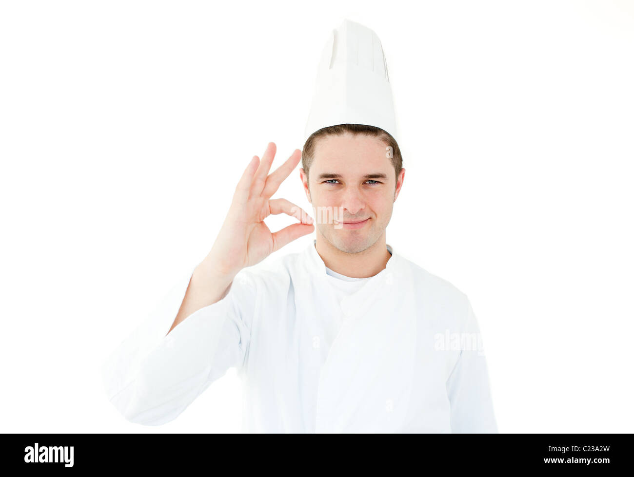 Handsome cook giving hand signal Stock Photo - Alamy