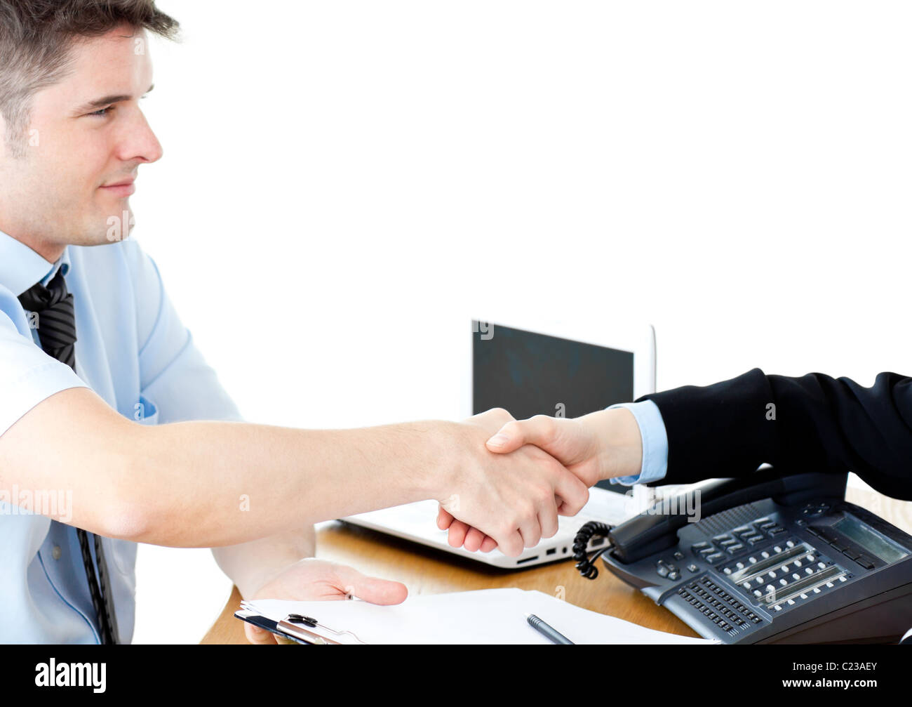 Assertive businesswoman shaking hands with a female customer Stock ...