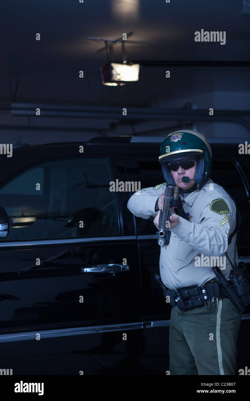 Nightwatch patrolman aims rifle Stock Photo - Alamy