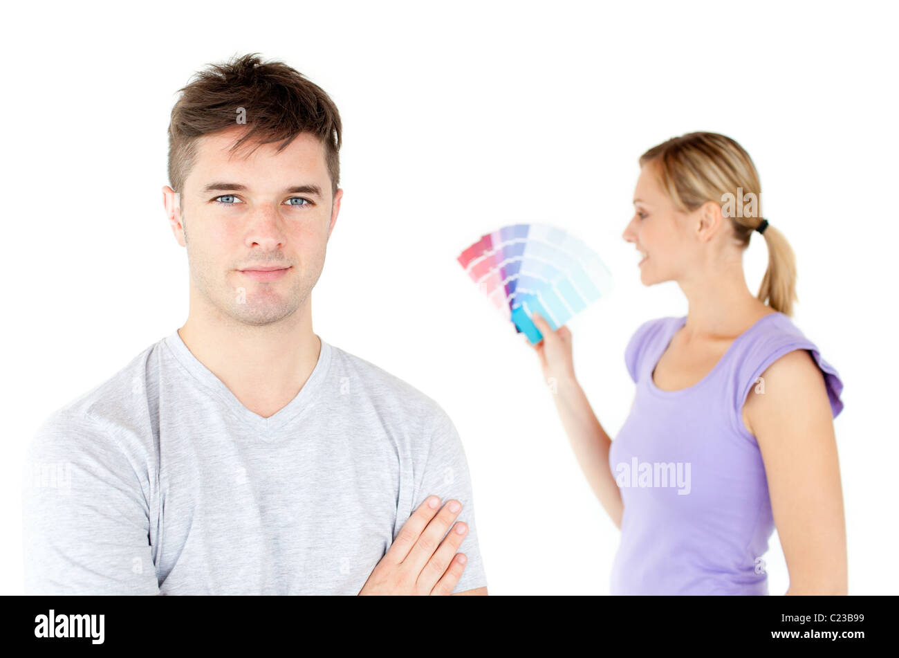 Young couple choosing colors for painting their room Stock Photo - Alamy