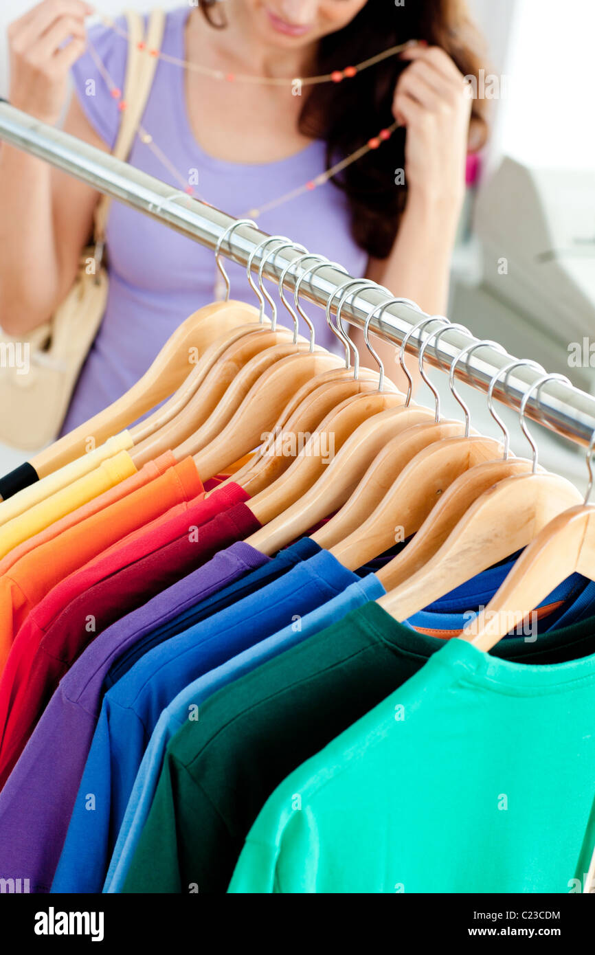 Close-up of clothes with a female customer Stock Photo - Alamy