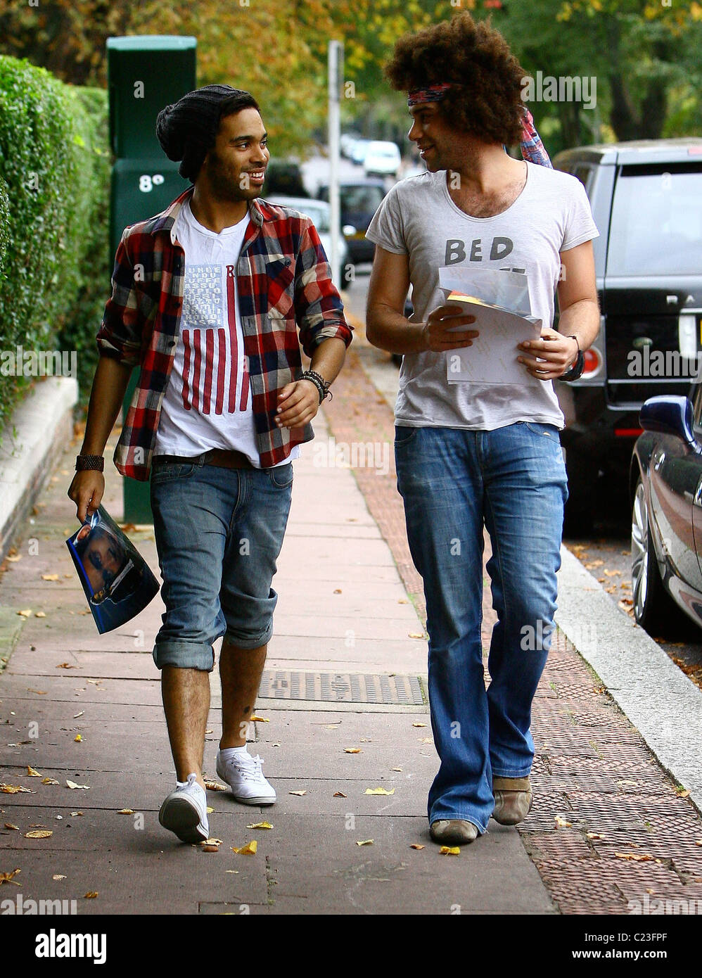 Jamie Archer and Danyl Johnson, who was is carrying a picture of ...