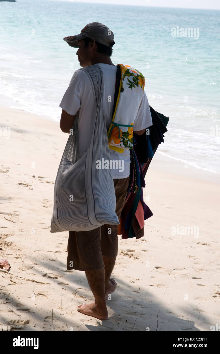 Beach vendor walking on the beach selling clothes, Koh Phangan ...