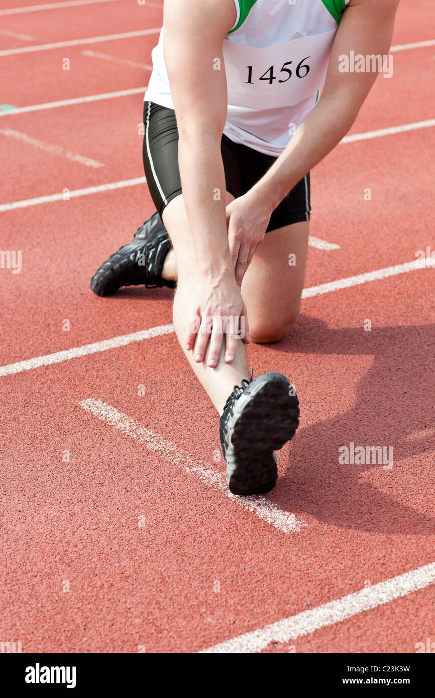 Sprinter stretching hi-res stock photography and images - Alamy