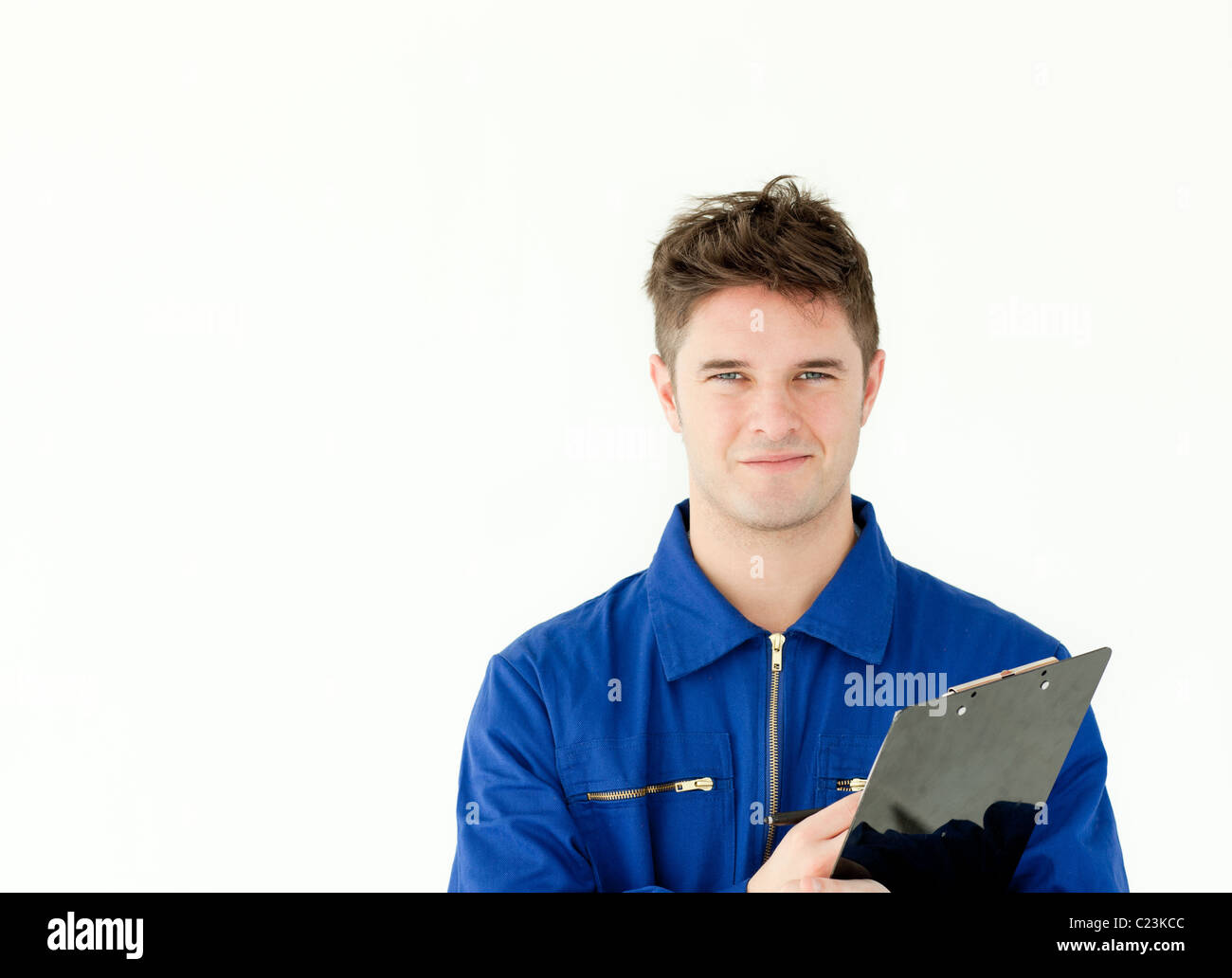 Good-looking male worker holding a document Stock Photo - Alamy