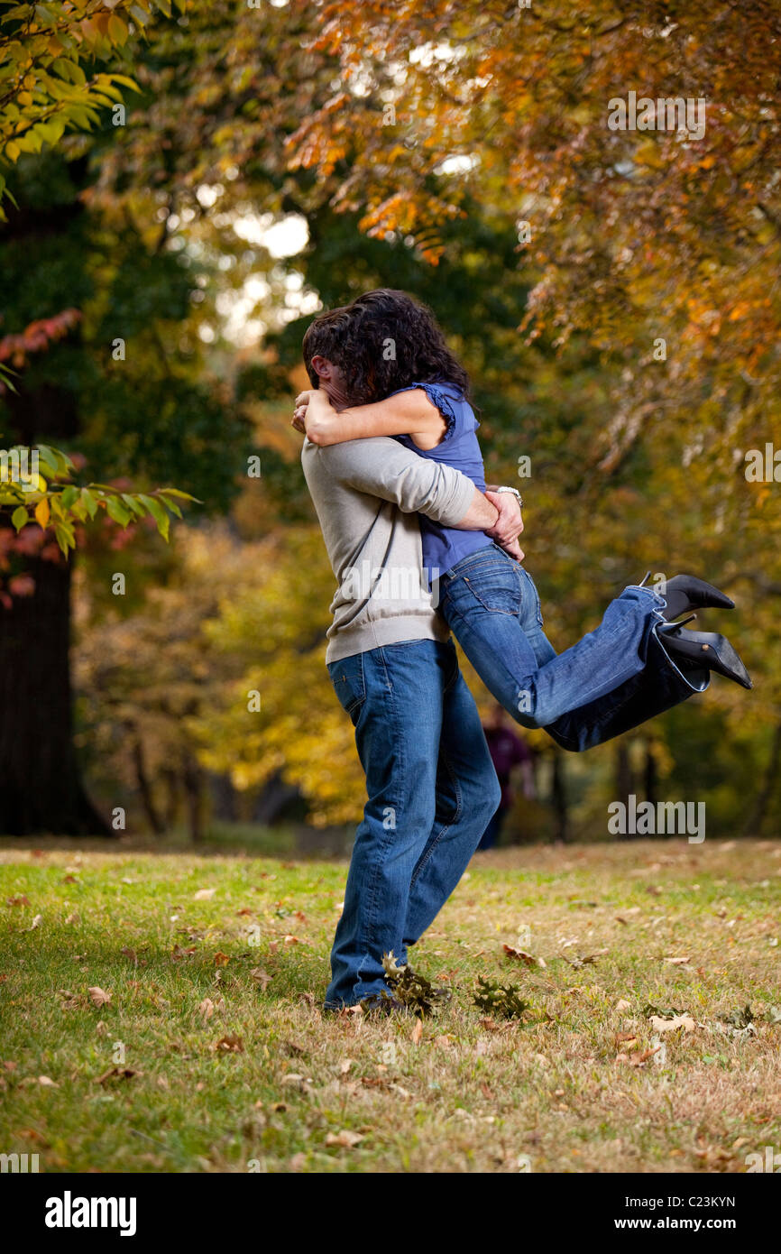 A man giving a woman a big hug - lifting her off the ground Stock Photo ...