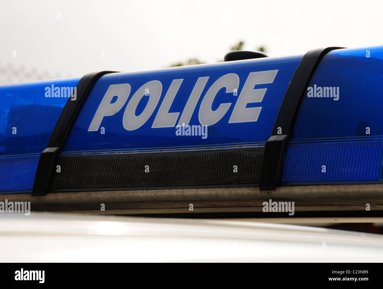 Police vehicle light array showing police in white on blue light Stock ...