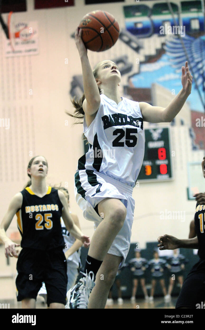 High school player finishes off a drive with an unobstructed layup and ...