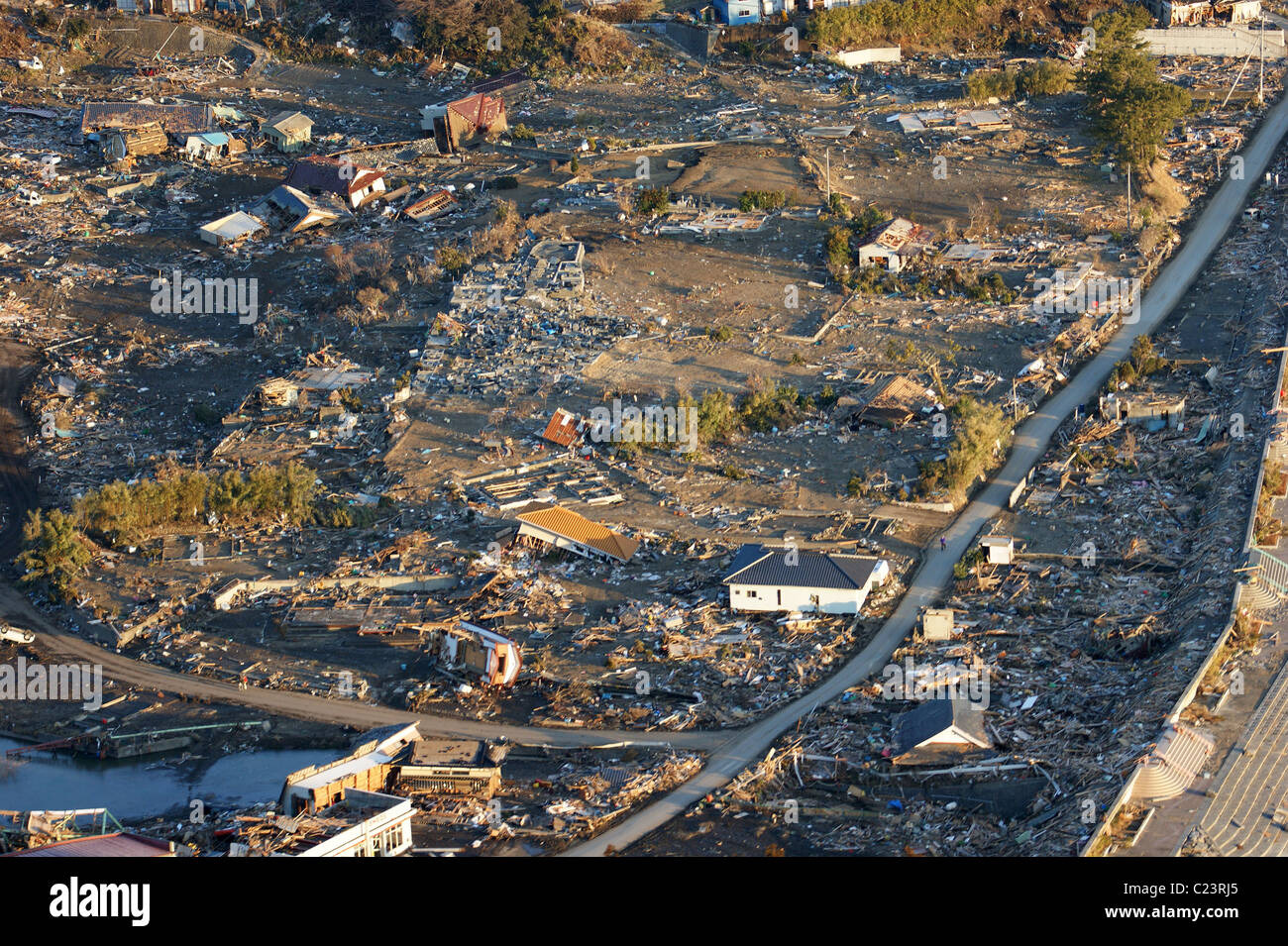 NORTH HONSHU, Japan (March 18, 2011) aerial view of damage after a 9.0 ...