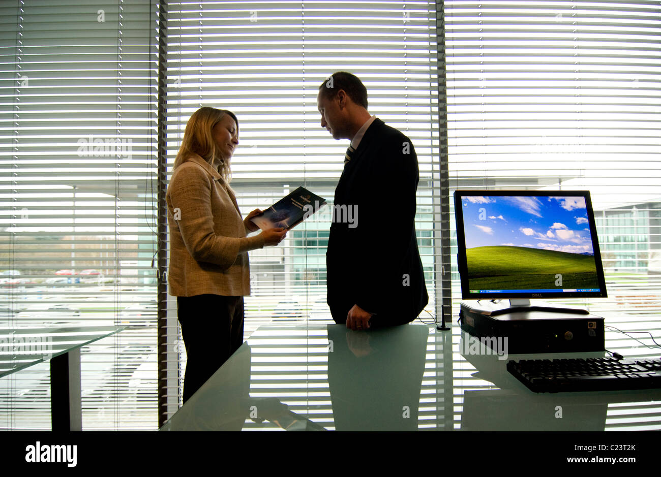 Office Meeting between manager and secretary Stock Photo - Alamy