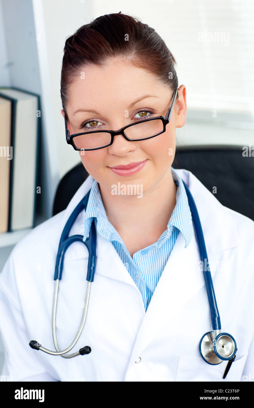 Confident female doctor smiling at the camera Stock Photo - Alamy