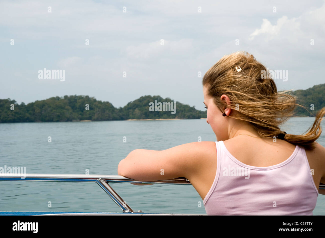 Tourist looking over the side of a boat, Thailand Stock Photo - Alamy