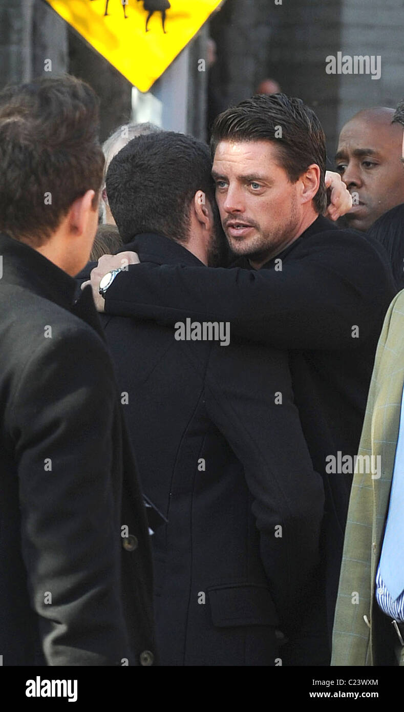 Keith Duffy hugs Shayne Ward The Requiem Mass prior to the funeral of ...