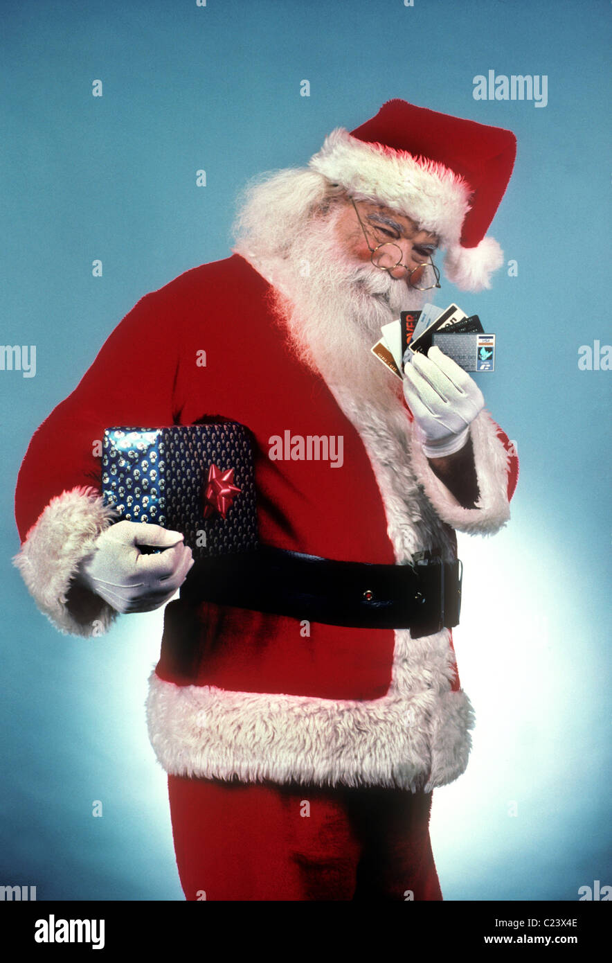 Santa Claus offerring the use of credit cards Stock Photo - Alamy
