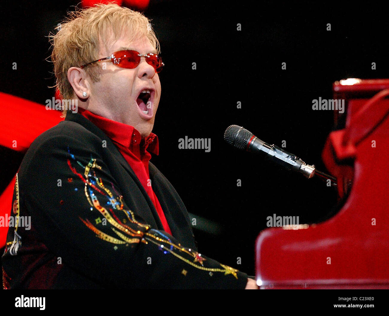 Elton John performing live in concert during his 'Red Piano Tour' at ...