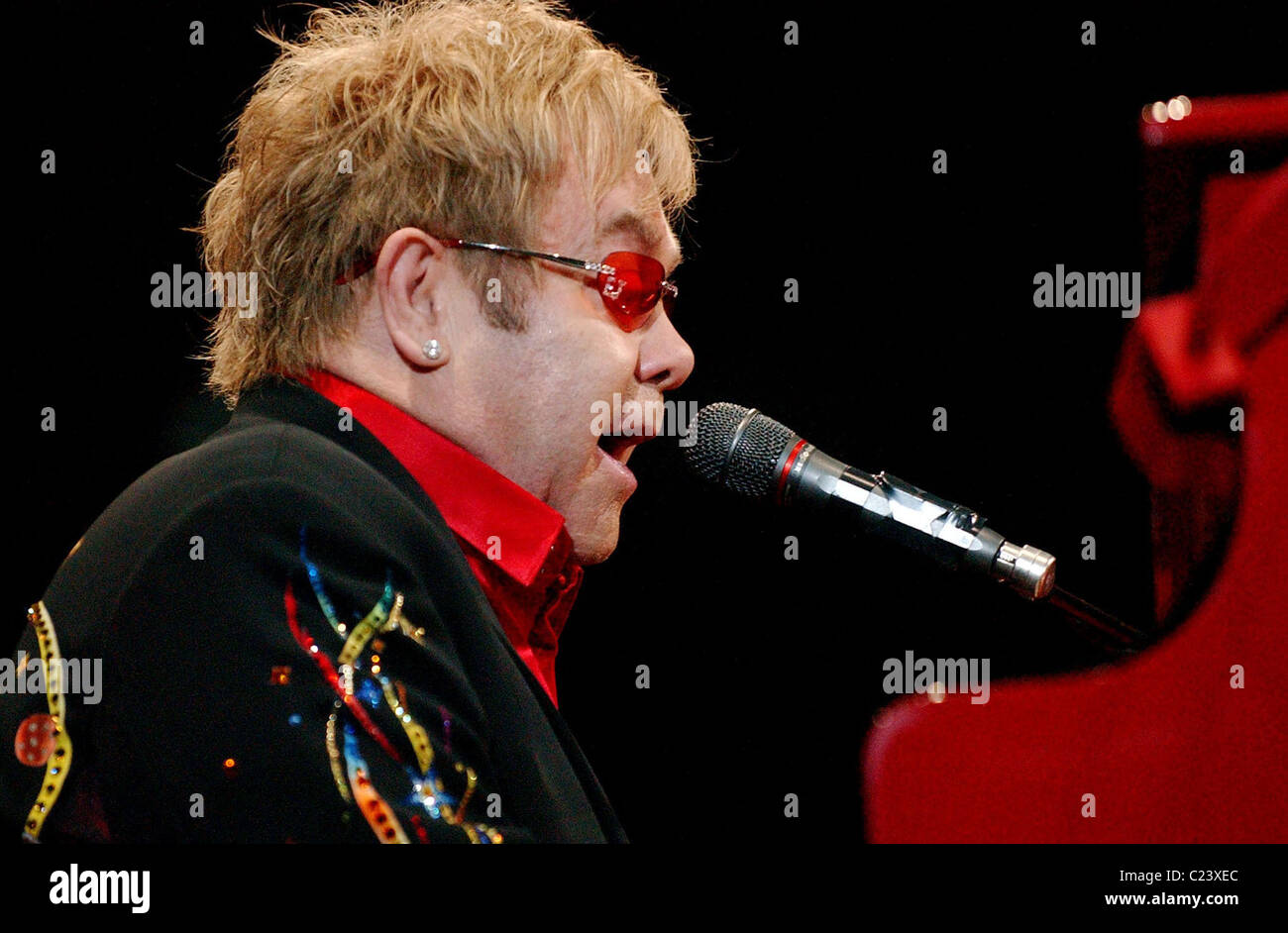 Elton John performing live in concert during his 'Red Piano Tour' at ...