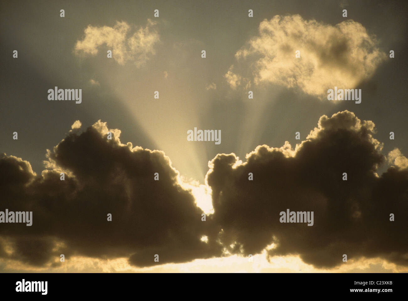 Golden light from behind clouds Stock Photo - Alamy