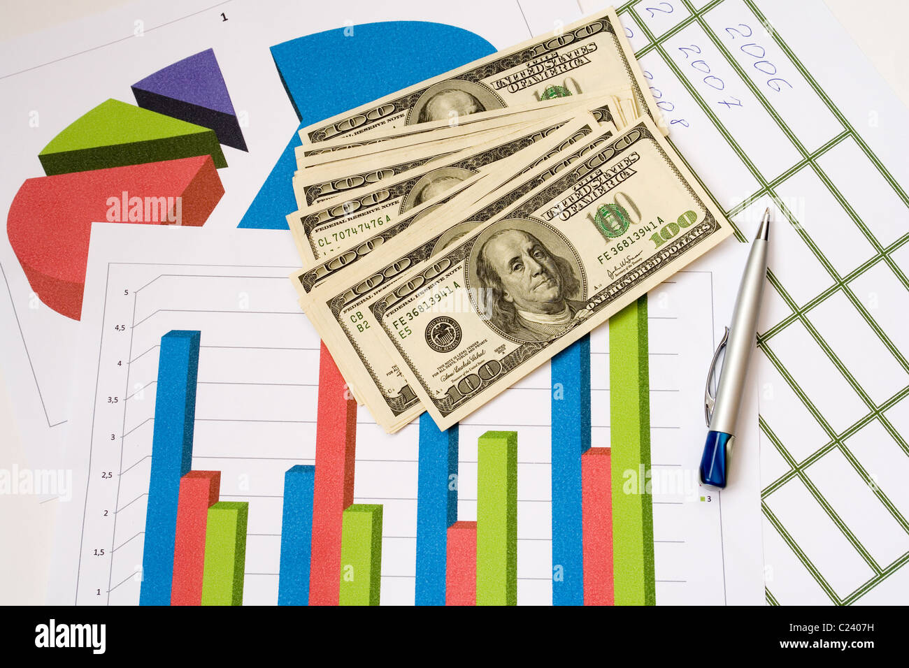 chart with money and pen Stock Photo - Alamy