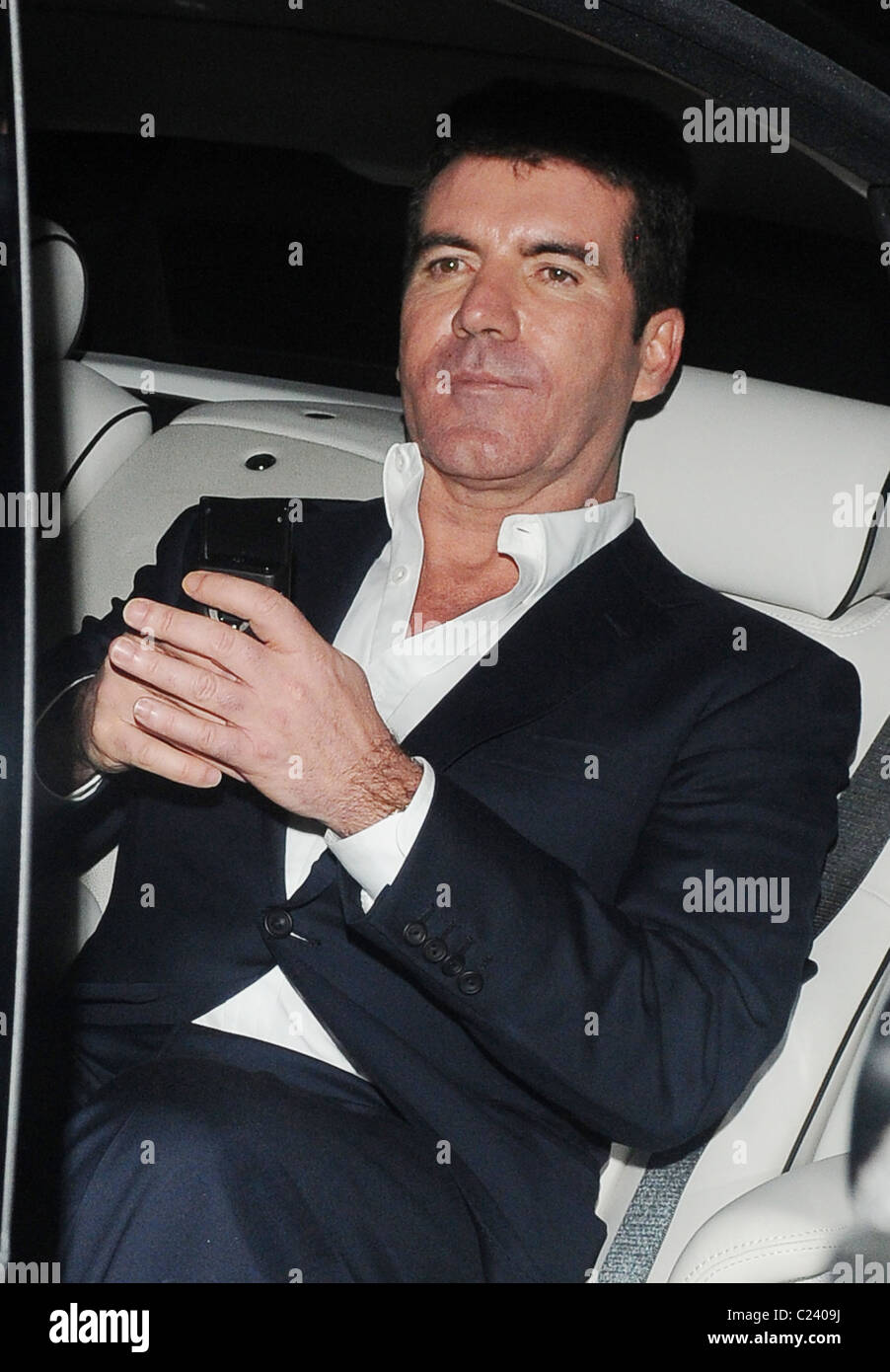 Simon Cowell outside the May Fair hotel for the Penthouse Party, after ...