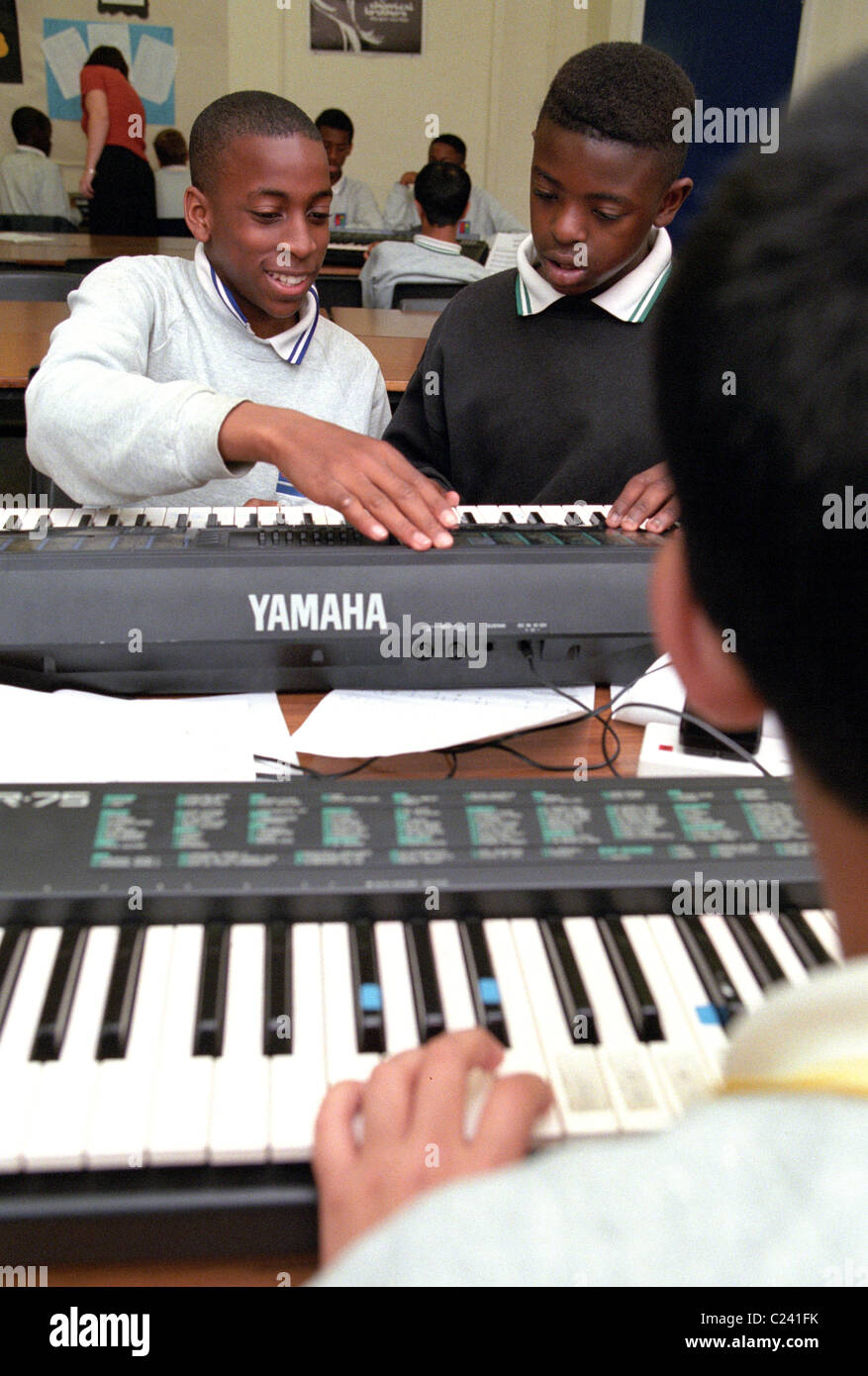 Secondary school students learning to play the Keyboard Stock Photo - Alamy