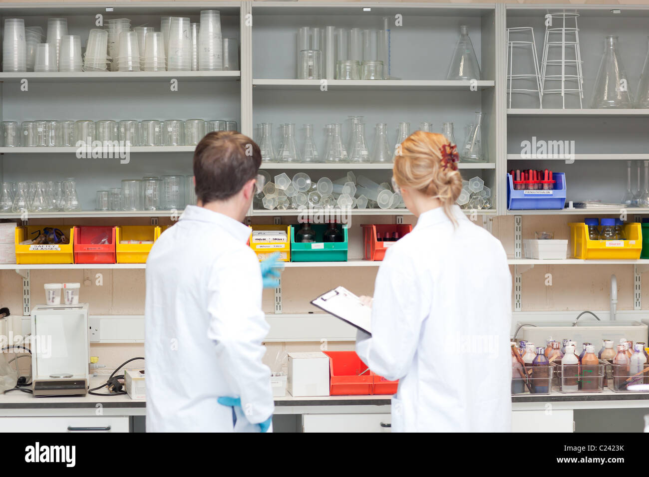 Concentrated scientists thinking Stock Photo - Alamy