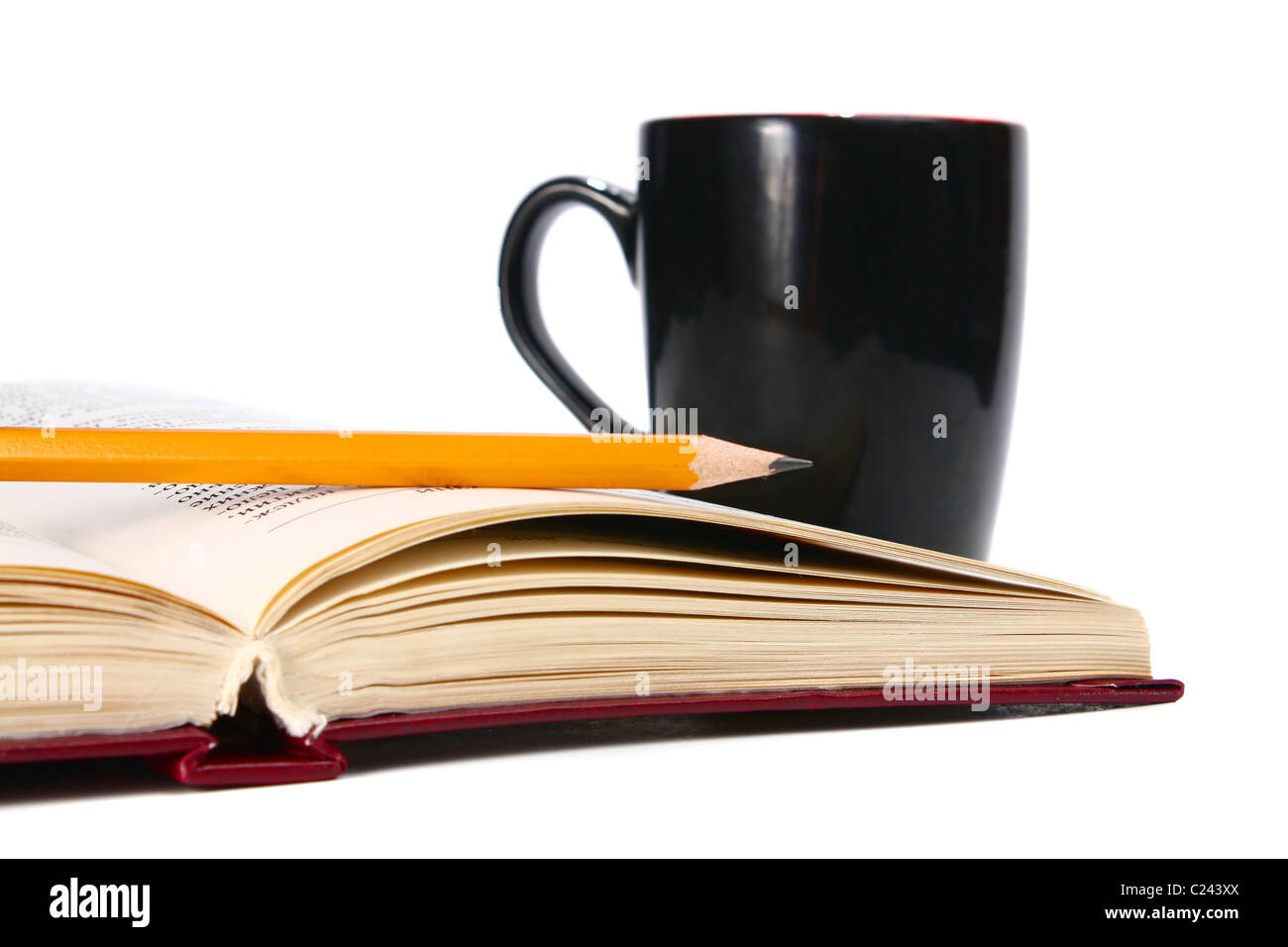book is a cup and pencil isolated on white background Stock Photo - Alamy