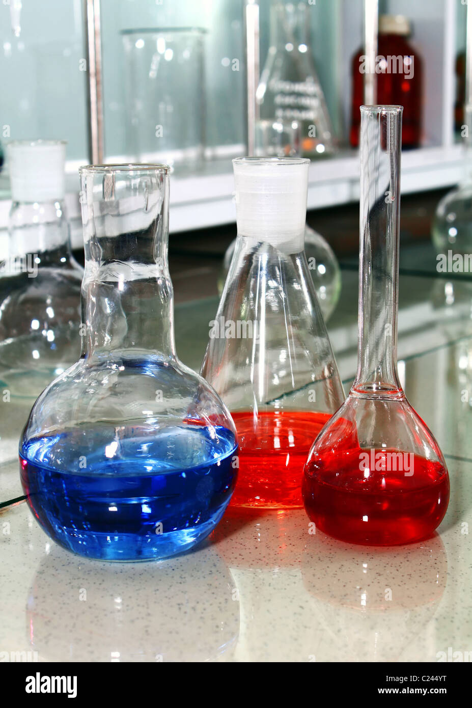 laboratory beakers with the coloured liquid Stock Photo - Alamy