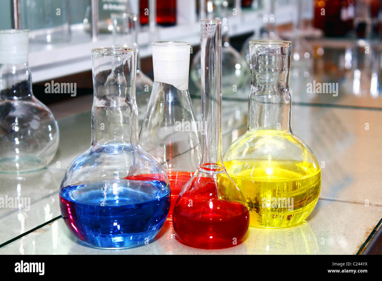 laboratory beakers with the coloured liquid Stock Photo - Alamy
