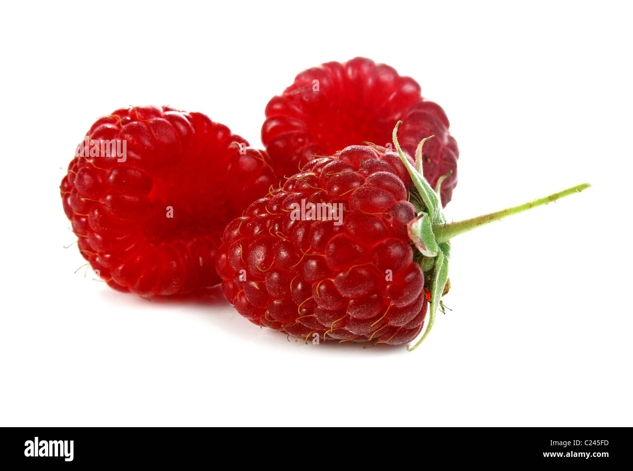 ripe red raspberry isolated on white background Stock Photo - Alamy