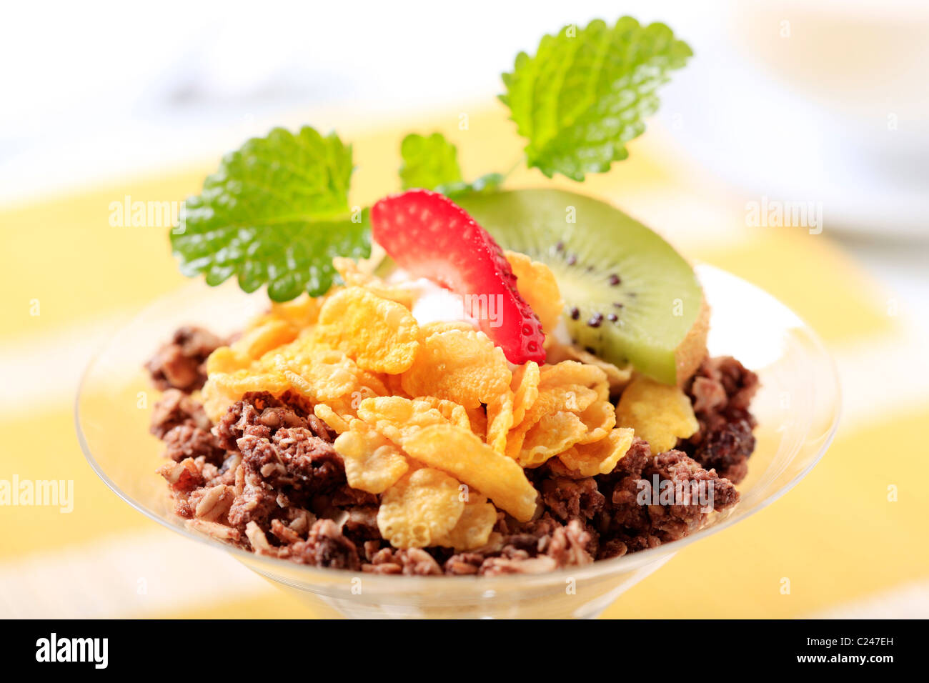 Chocolate granola and corn flakes topped with fruit Stock Photo - Alamy
