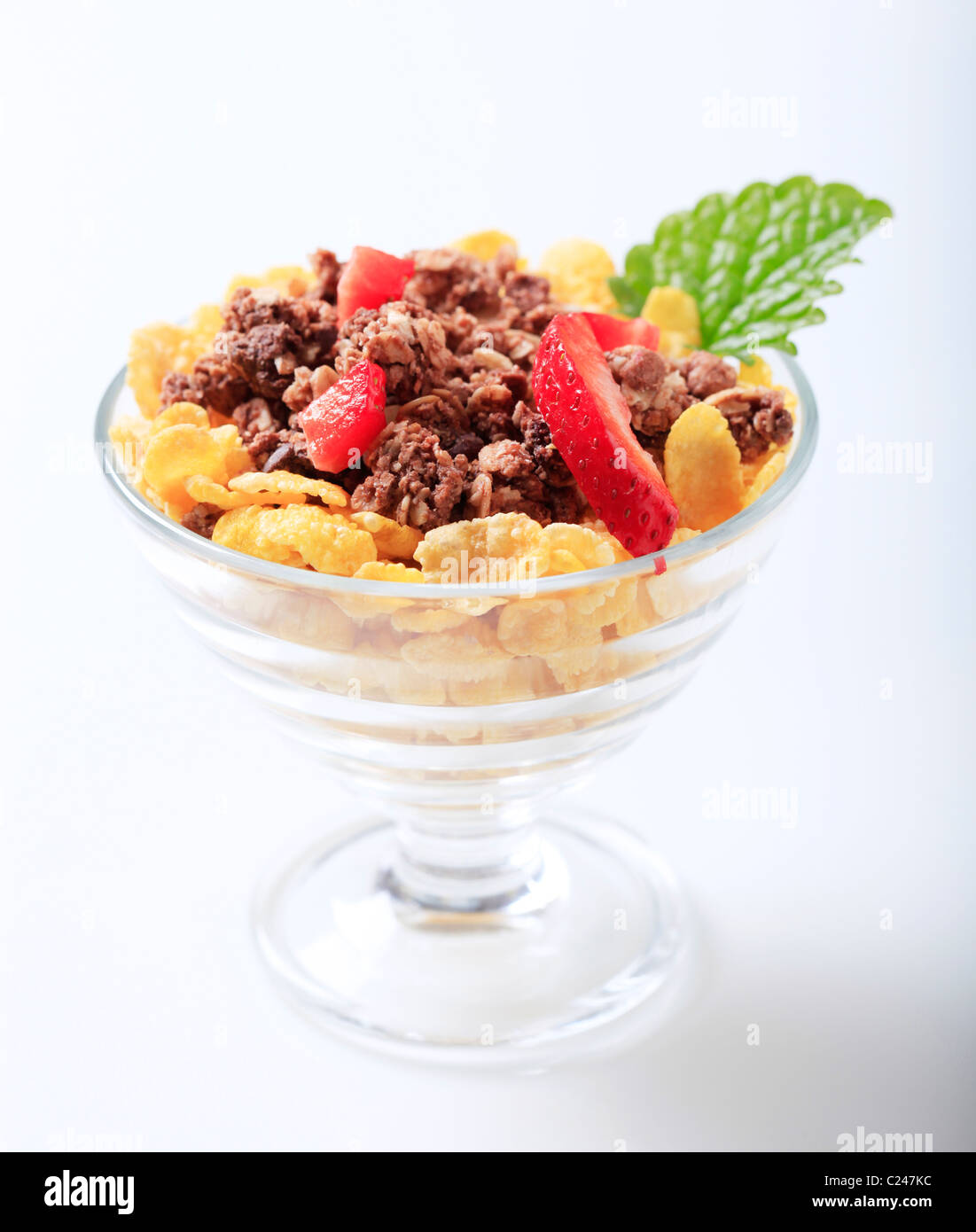 Chocolate granola and corn flakes topped with fruit Stock Photo - Alamy