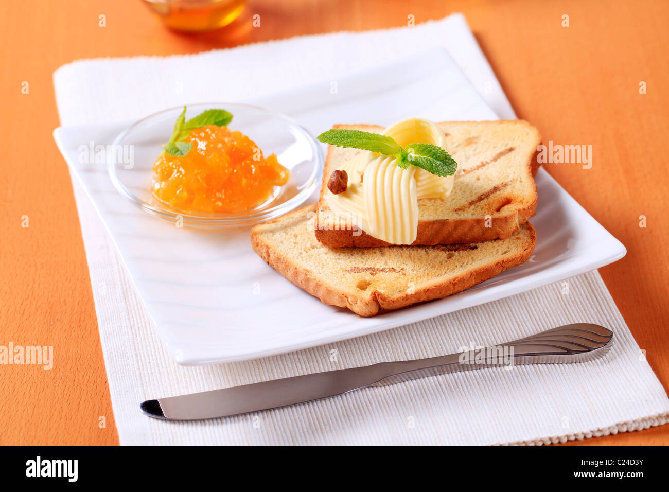 Breakfast - Toasted bread, butter and marmalade Stock Photo - Alamy