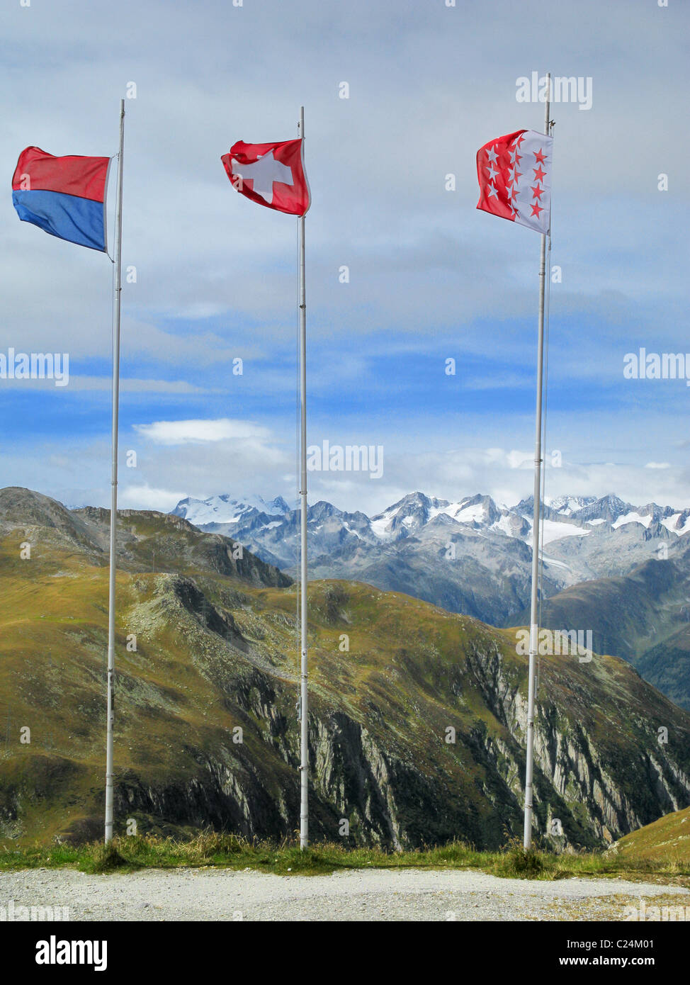 Flags of Switzerland (middle), canton Ticino (left) and canton Valais ...