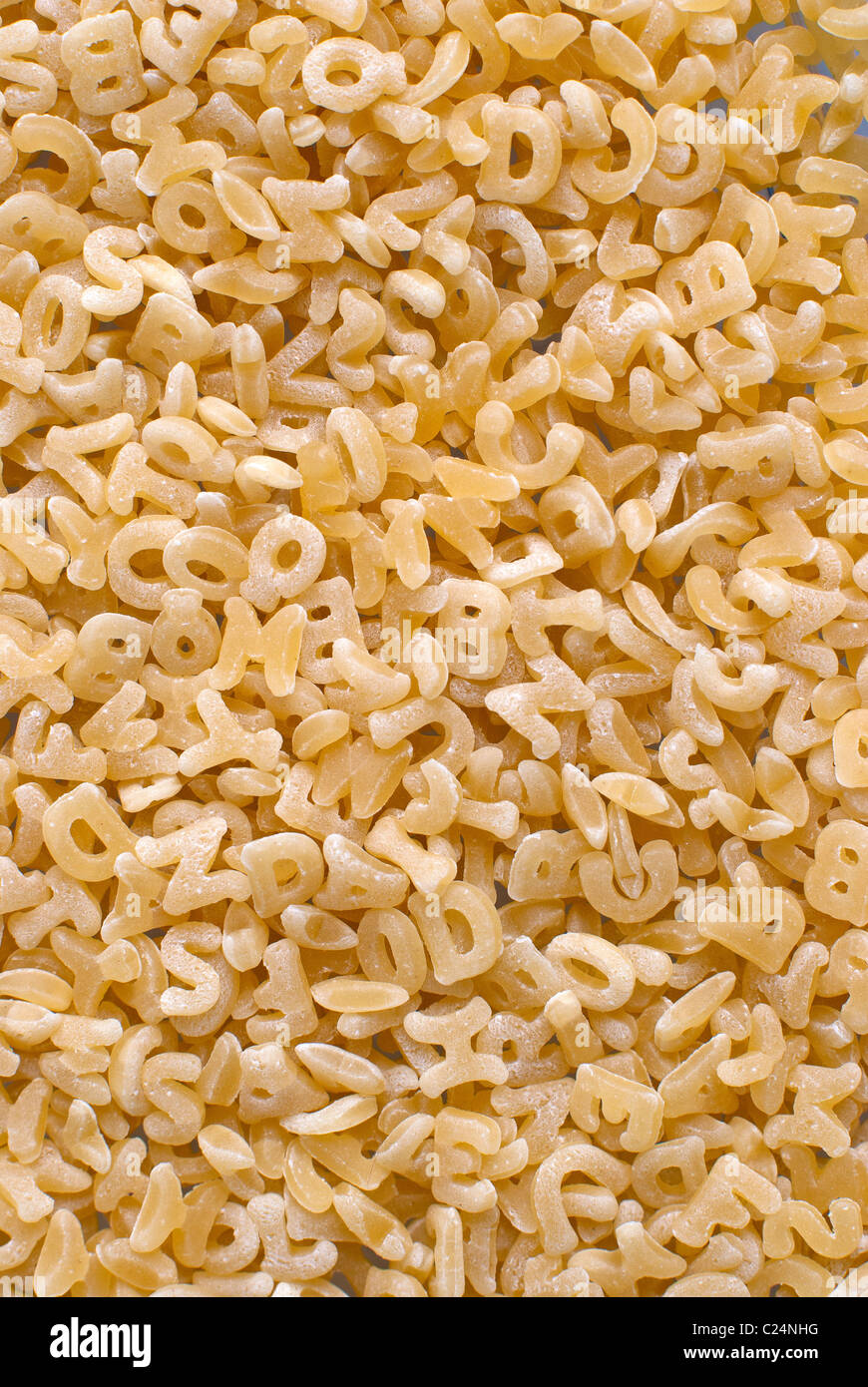 Close-up background of alphabet noodle showing letters Stock Photo - Alamy