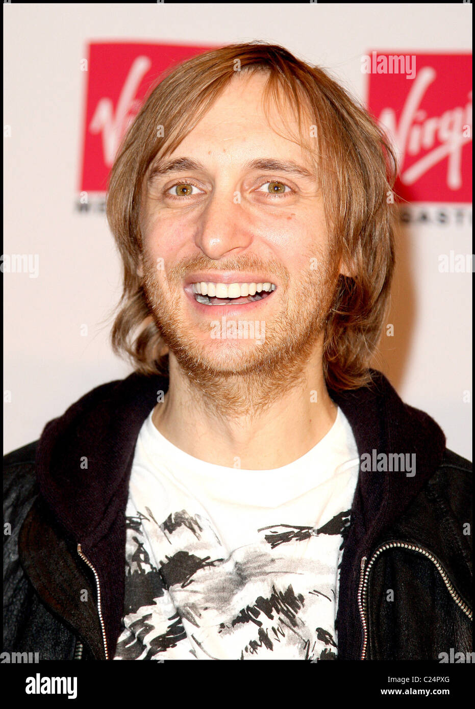 David Guetta promotes new game 'Dj Hero' at Virgin Champs Elysees Paris ...