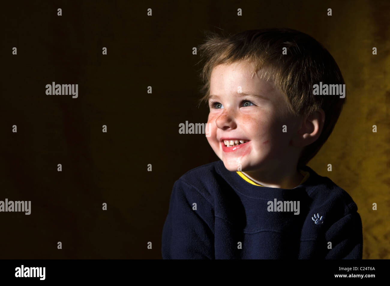 Portrait of a young boy as he's playing Stock Photo - Alamy