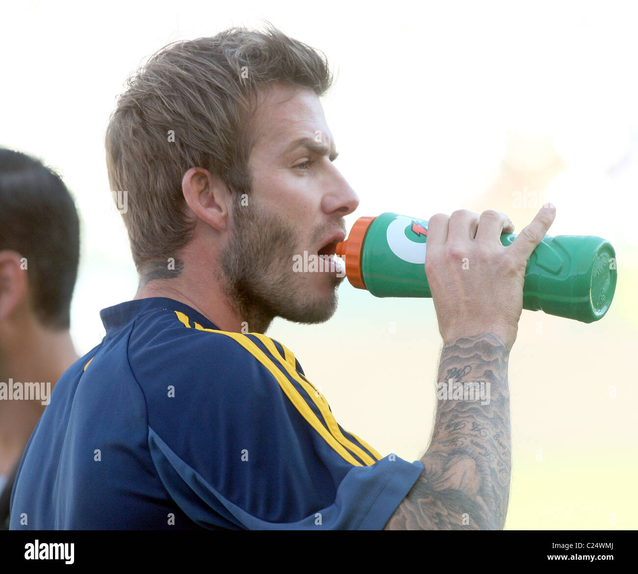David Beckham of the Los Angeles Galaxy has a drink while doing warm ...