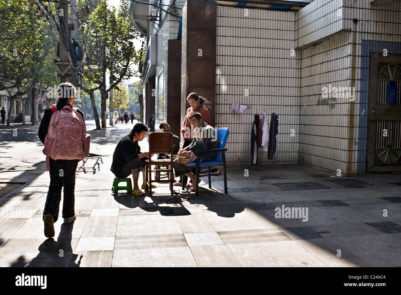 CHINA, WUHAN: Street scene in Wuhan with men playing a card game on ...