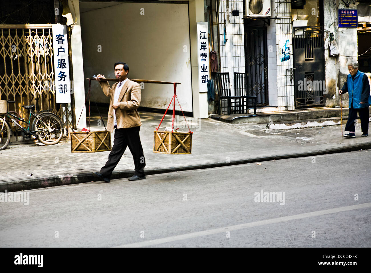 Shoulder carrying pole china hi-res stock photography and images - Alamy
