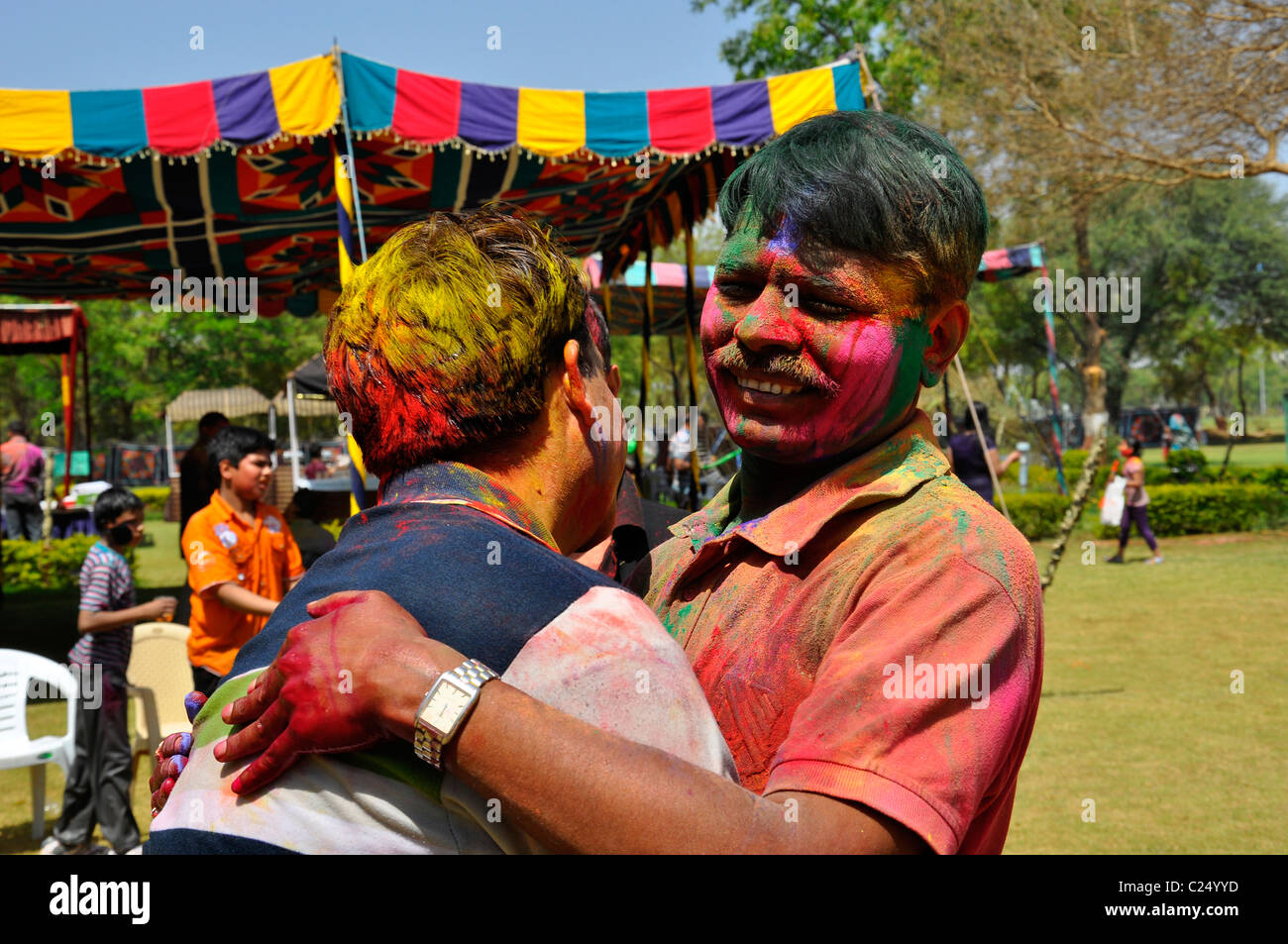 Holi festival- Two Indians hugging each other Stock Photo - Alamy
