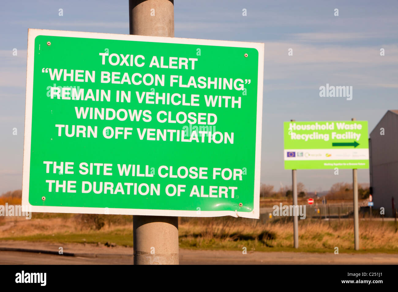 A warning sign about toxic air pollution outside a power from waste ...